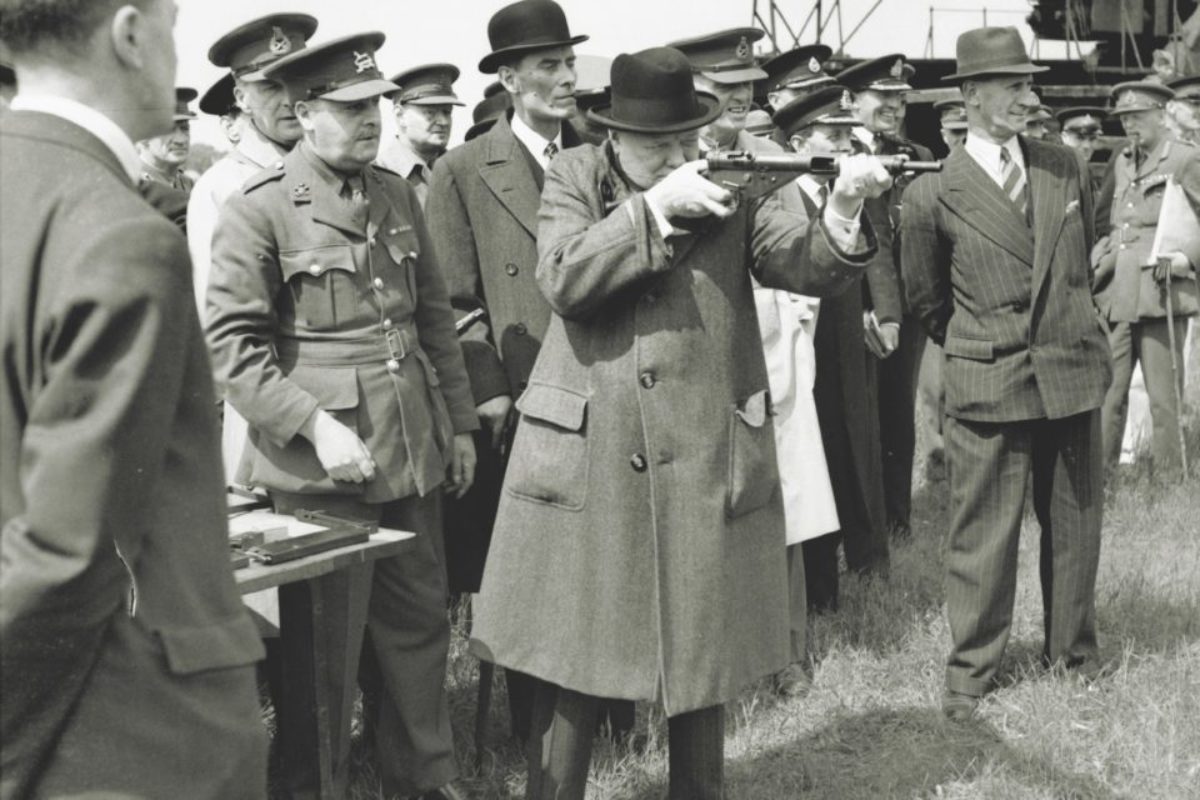 Winston Churchill fires a Sten gun.